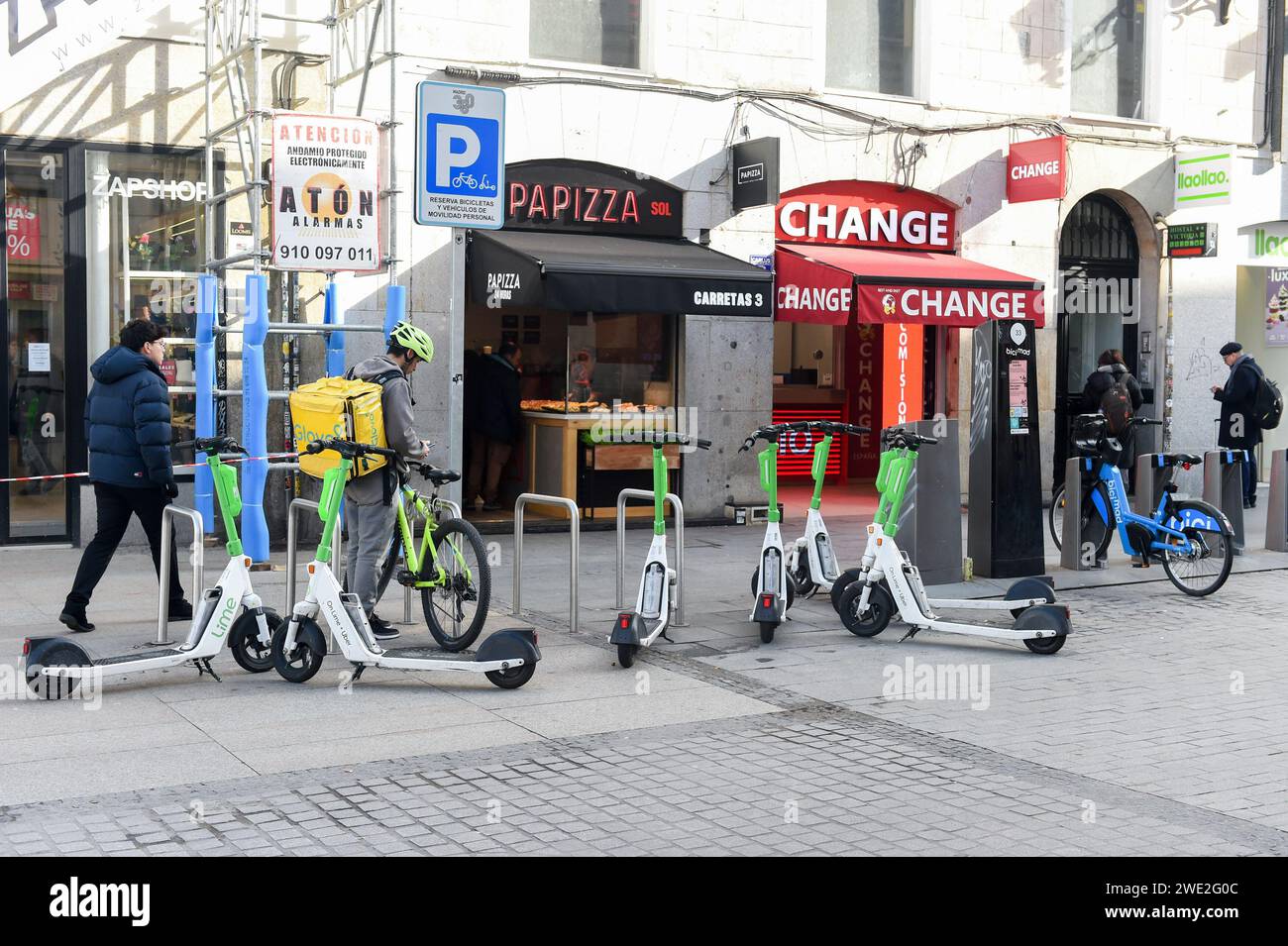 Madrid, Spain. 22nd Jan, 2024. Some electric scooters are parked in the ...