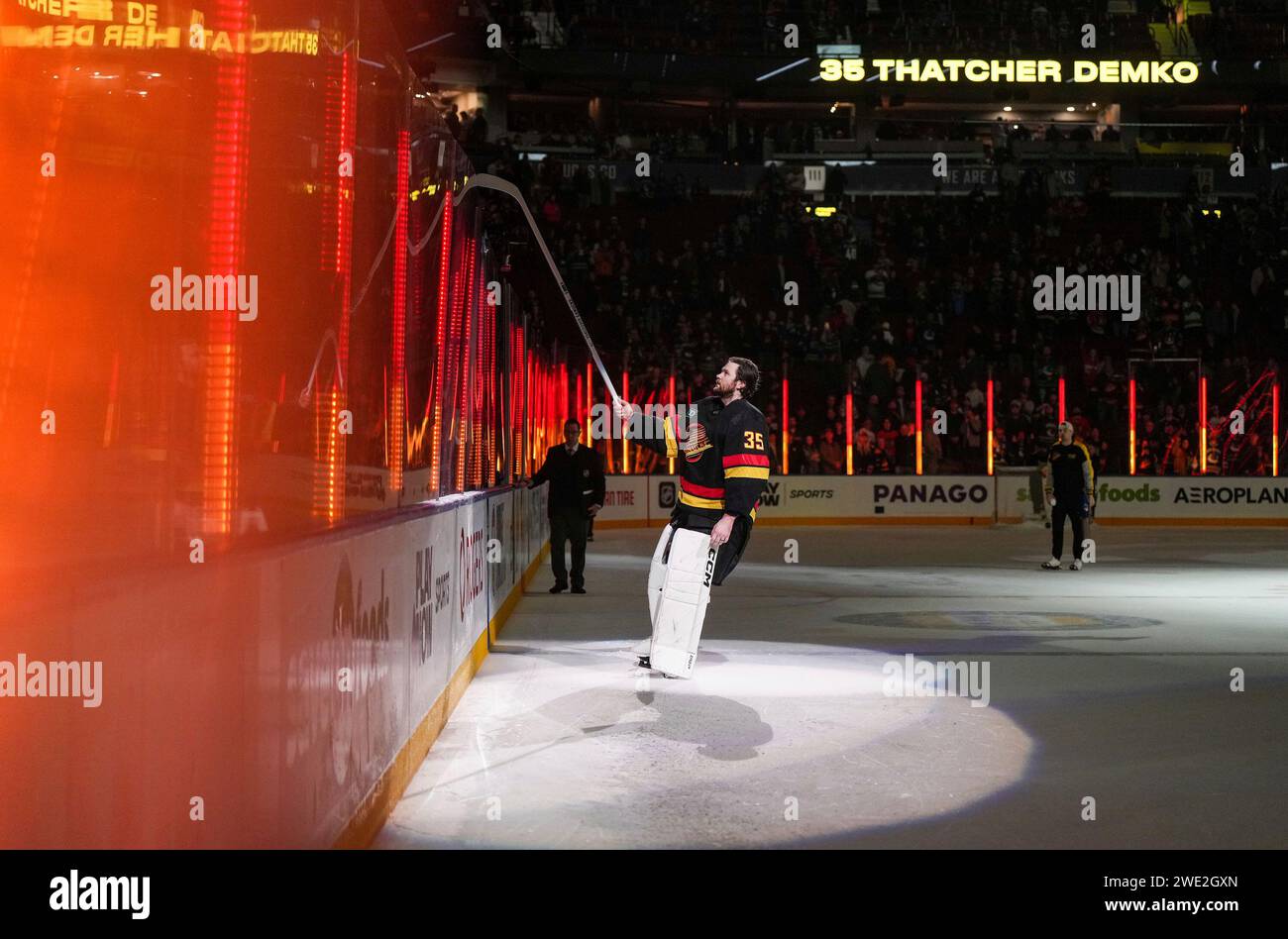 Vancouver Canucks goalie Thatcher Demko tosses a stick into the crowd ...