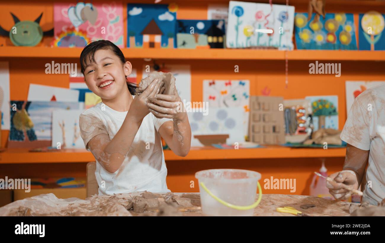 Child making mud art hi-res stock photography and images - Alamy