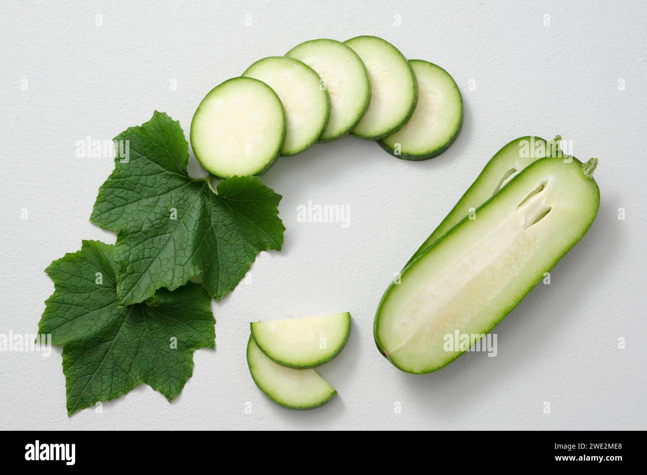 Against the white background, slices of winter melon (also known as ash ...