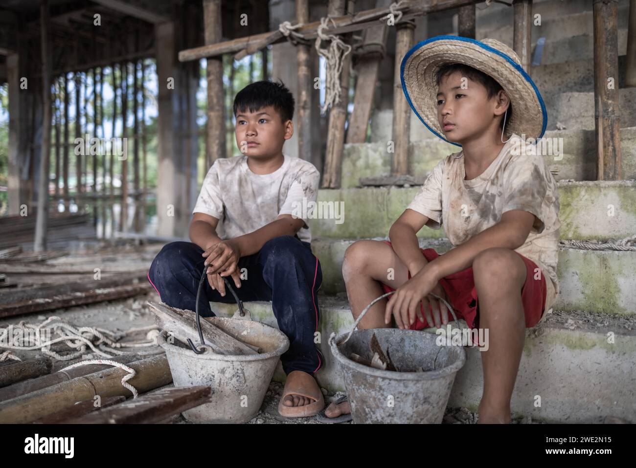 Children working at construction site. Concept against child labor and ...