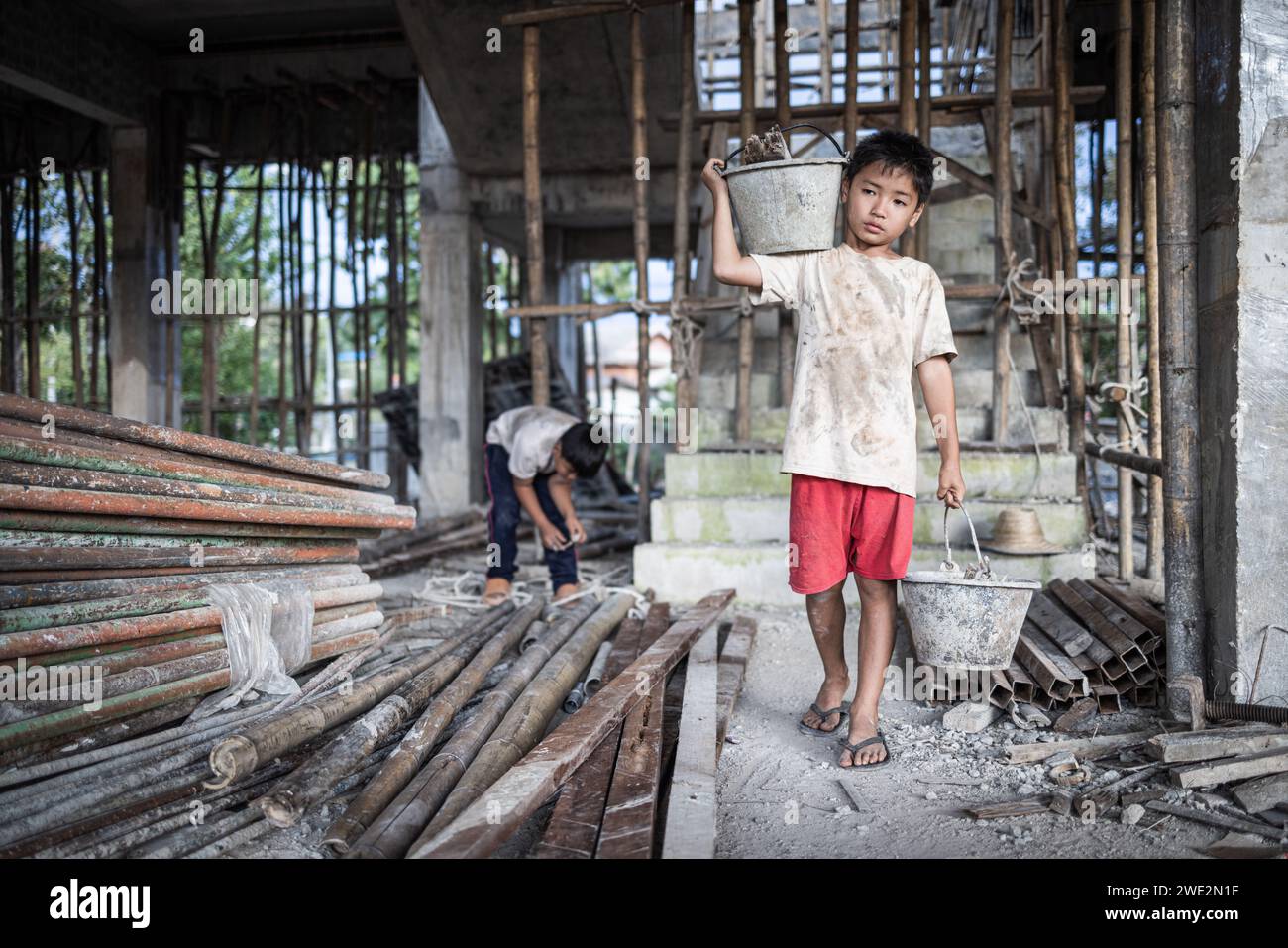 Children working at construction site. Concept against child labor and ...