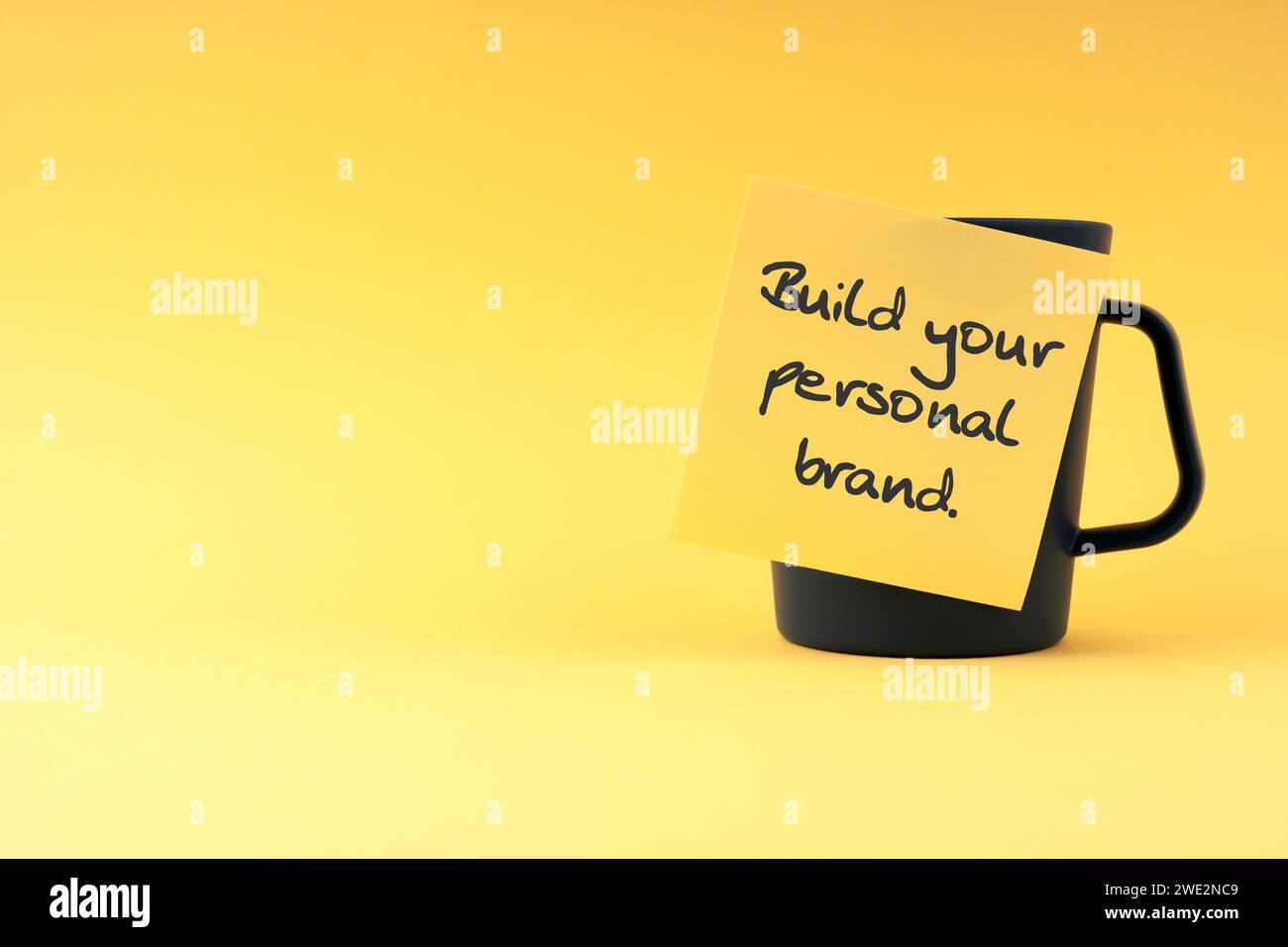 Build your personal brand text on sticky yellow adhesive note on yellow ...