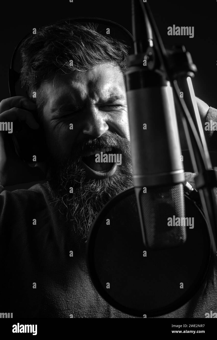 Man singing in recording studio Black and White Stock Photos & Images ...