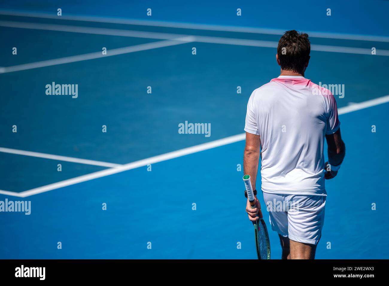 female Professional athlete Tennis player playing on a court in a ...