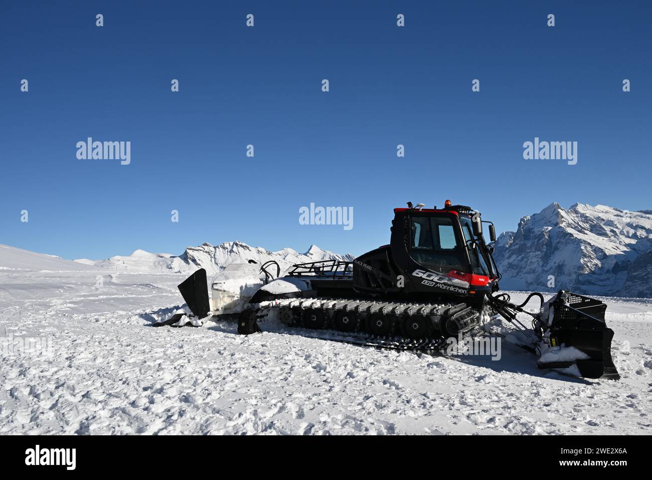 A snowcat rests gracefully amidst the snowy landscape Stock Photo - Alamy