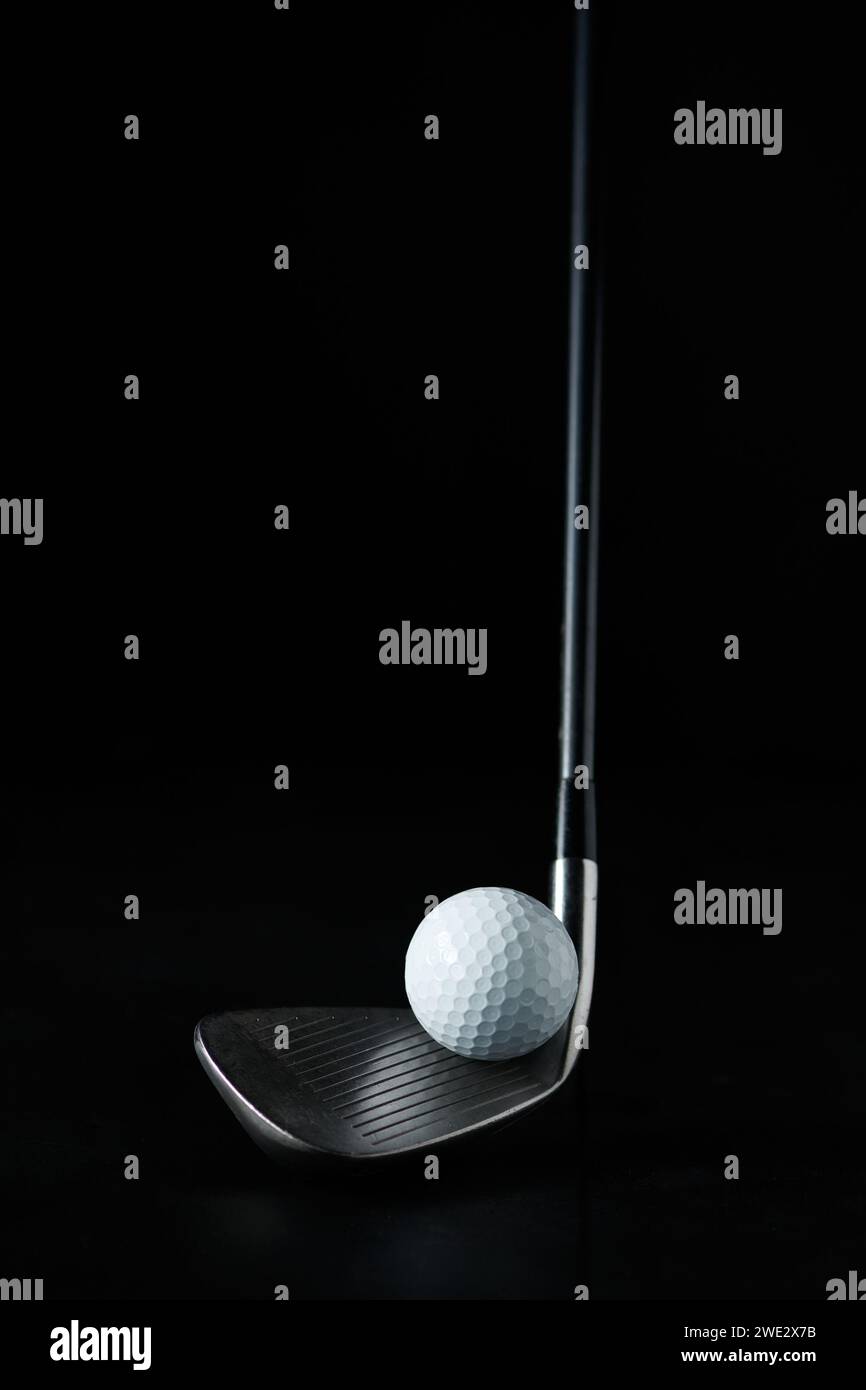 photo of a golf stick with the focus set on the golf ball in front of ...
