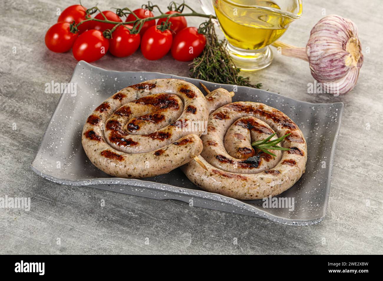 Grilled natural spiral meat juicy sausage Stock Photo - Alamy