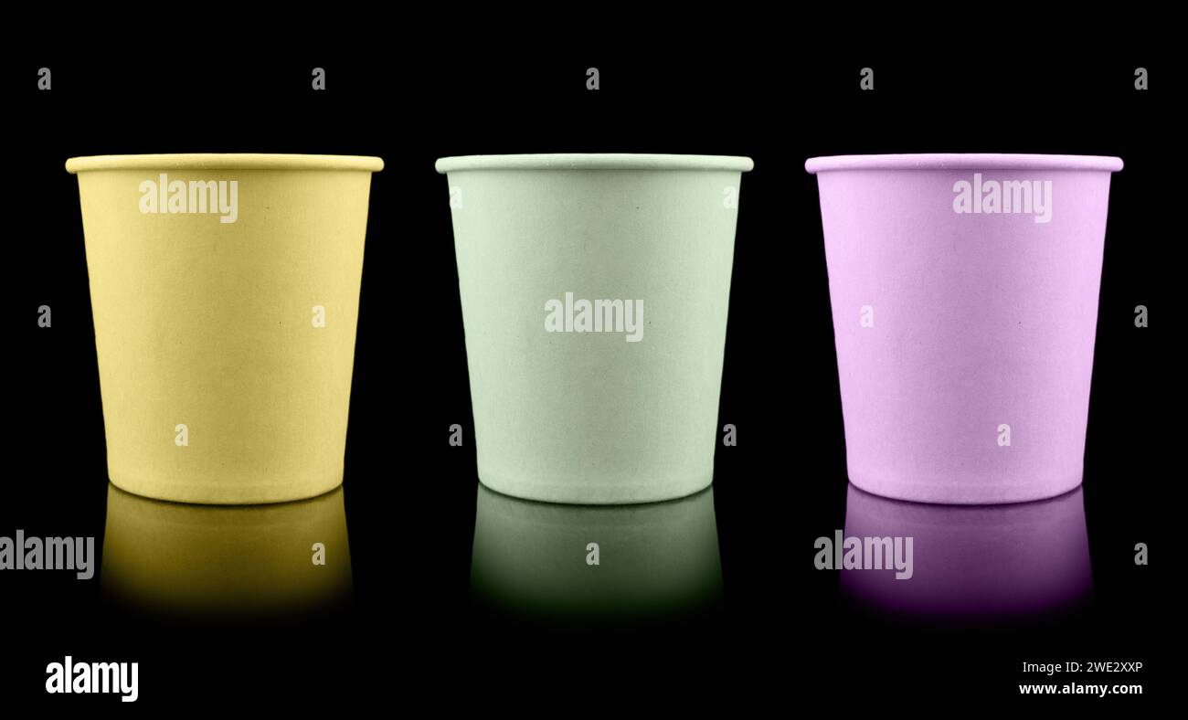 Side view three empty disposable paper fast food cup isolated on black ...
