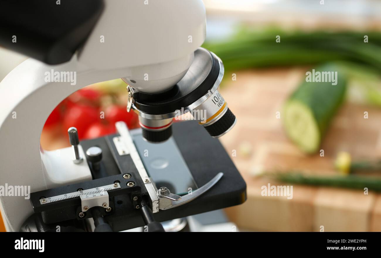 Microscope head on kitchen background Stock Photo - Alamy