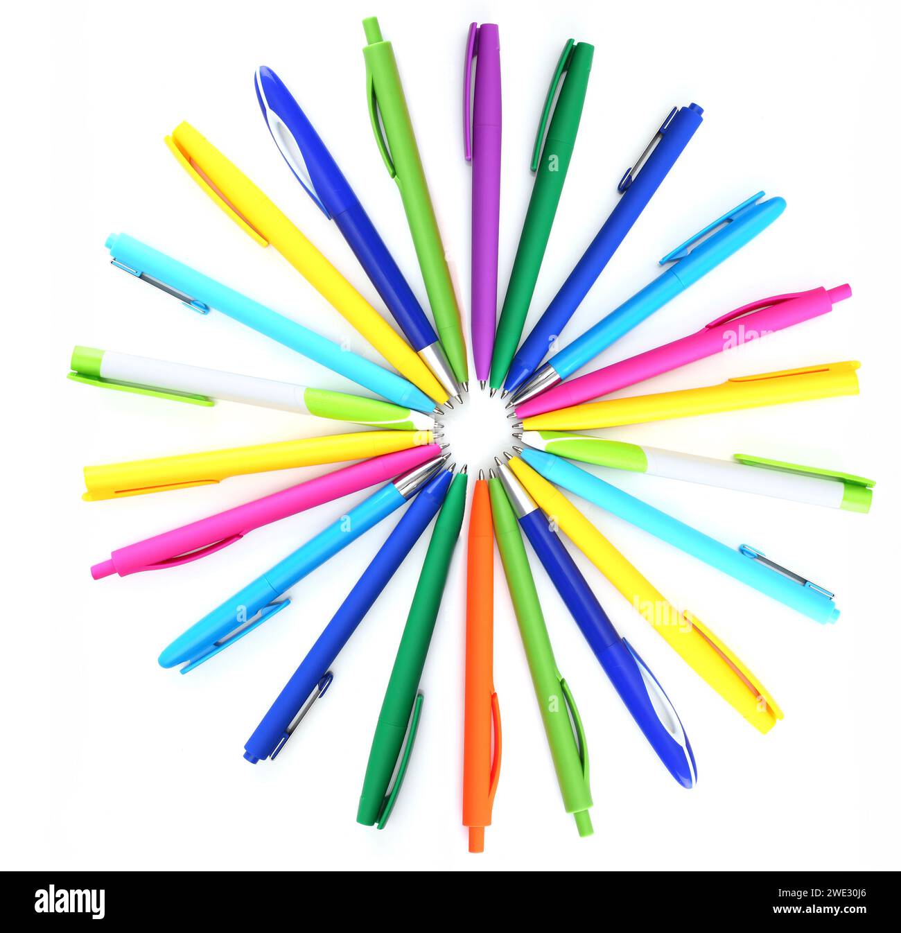 Multi colored ball pens on white background Stock Photo - Alamy