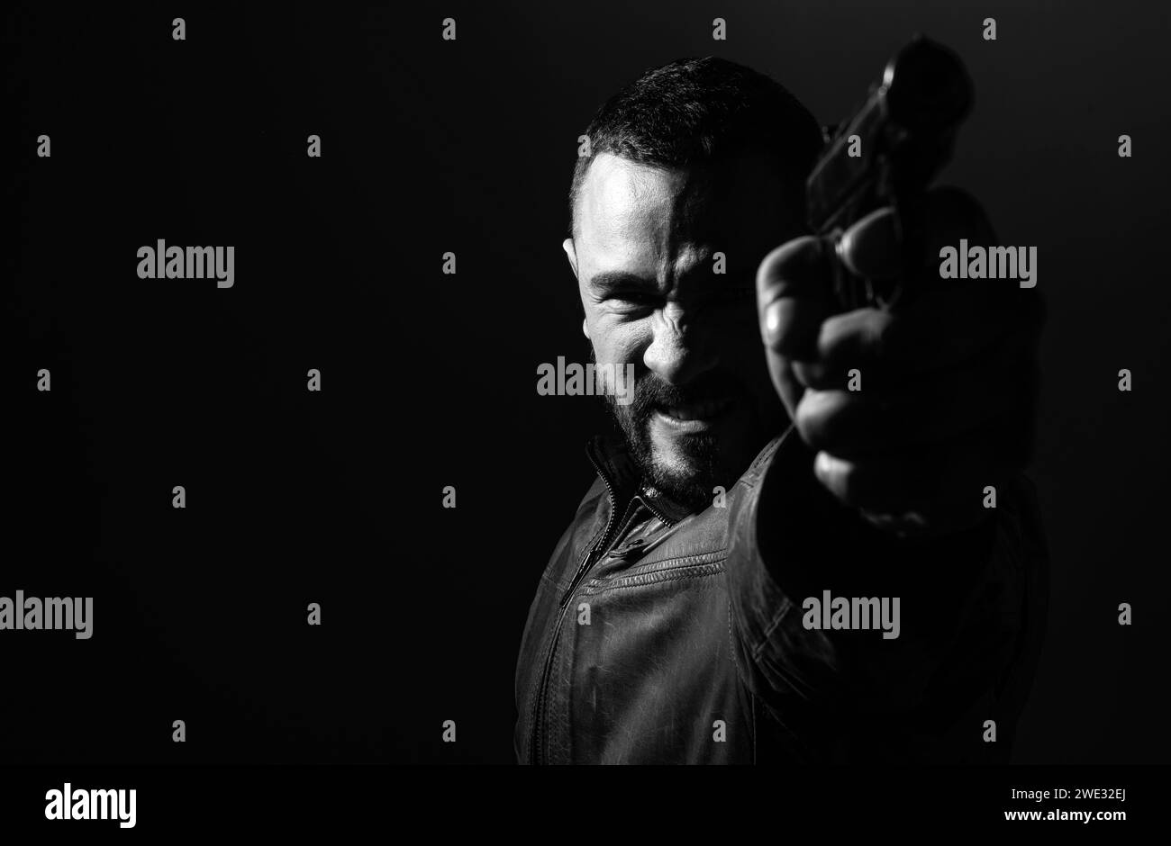 Brutal angry gang man lifestyle. Gangster in action, killer aiming ...