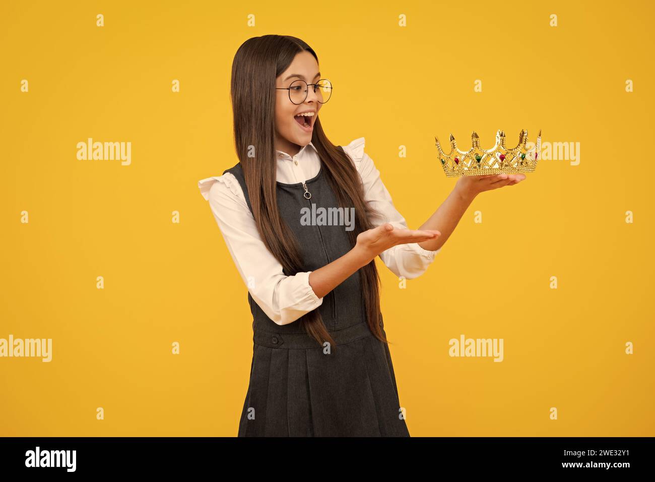Portrait of ambitious teenage girl with crown, feeling princess ...