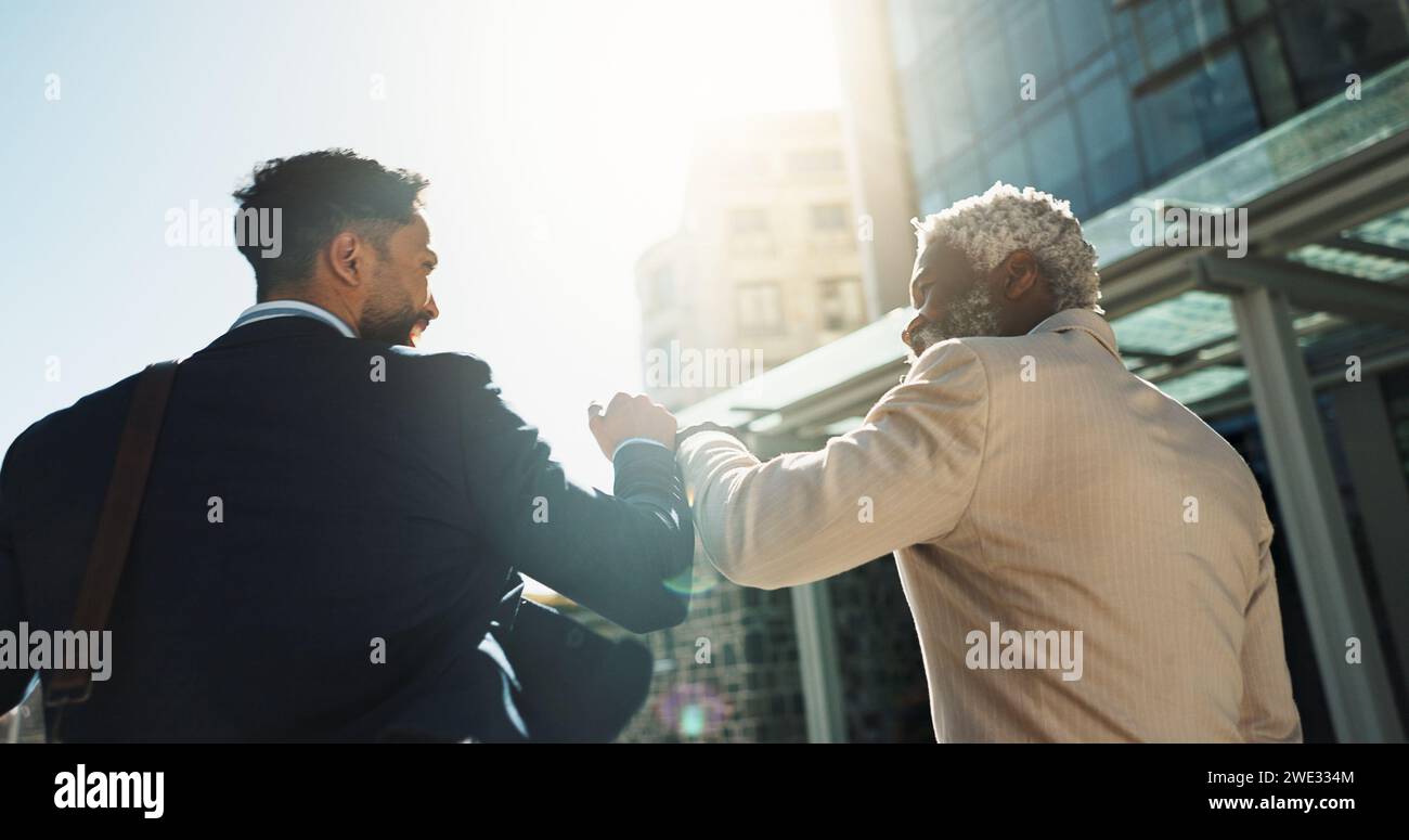 Business men, fist bump and team in street with smile, support and ...