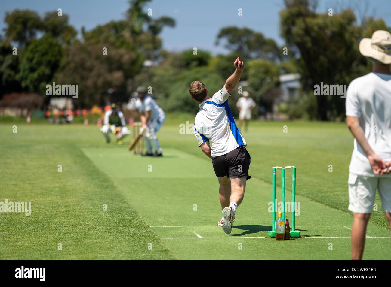 playing a game on a green over for health and recreation in australia ...