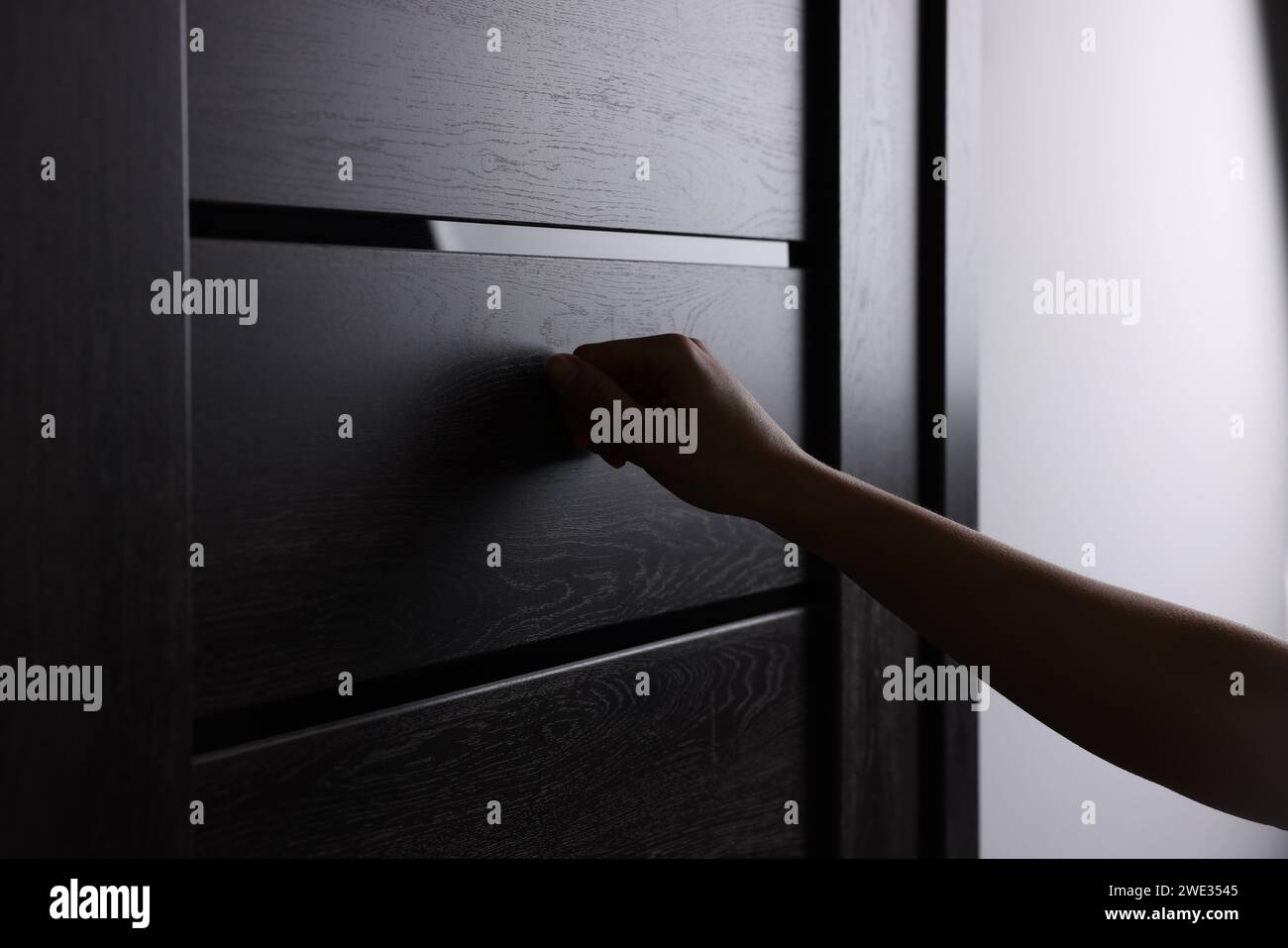 Woman knocking door hi-res stock photography and images - Alamy