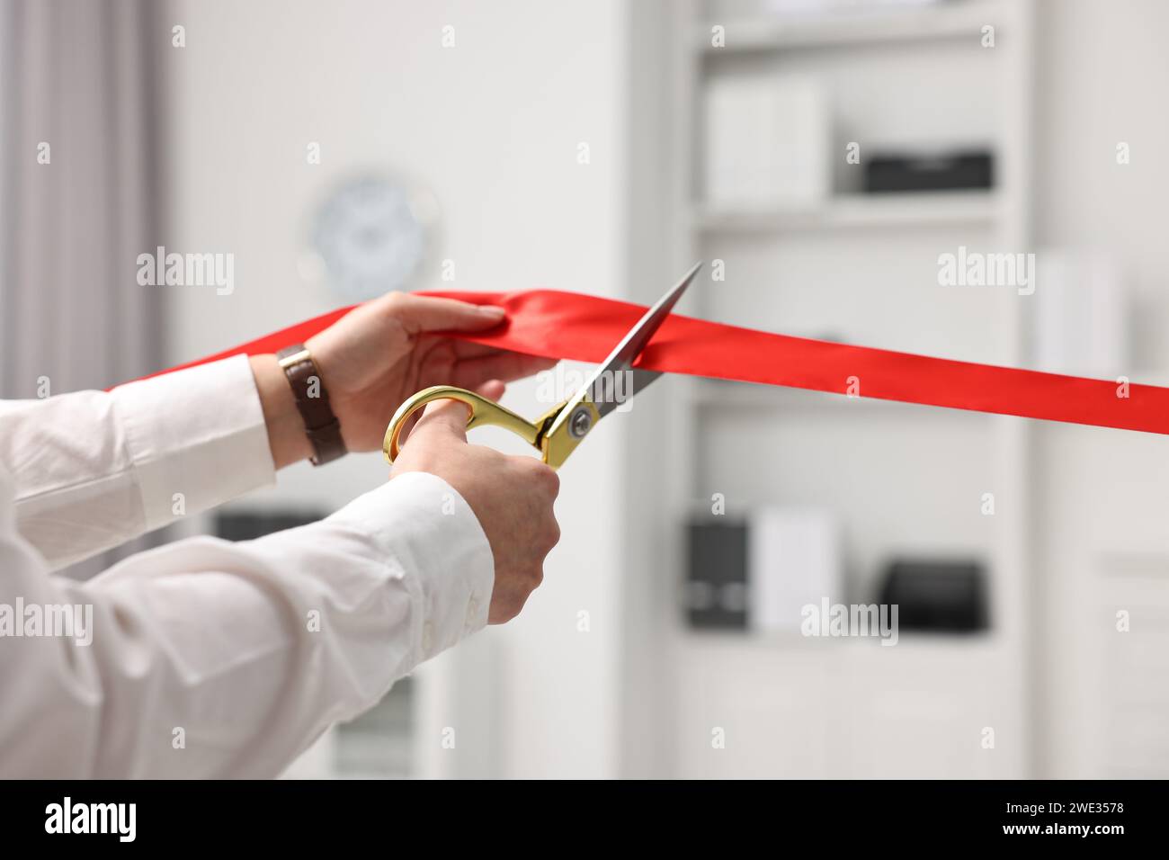 Woman cut red ribbon hi-res stock photography and images - Alamy