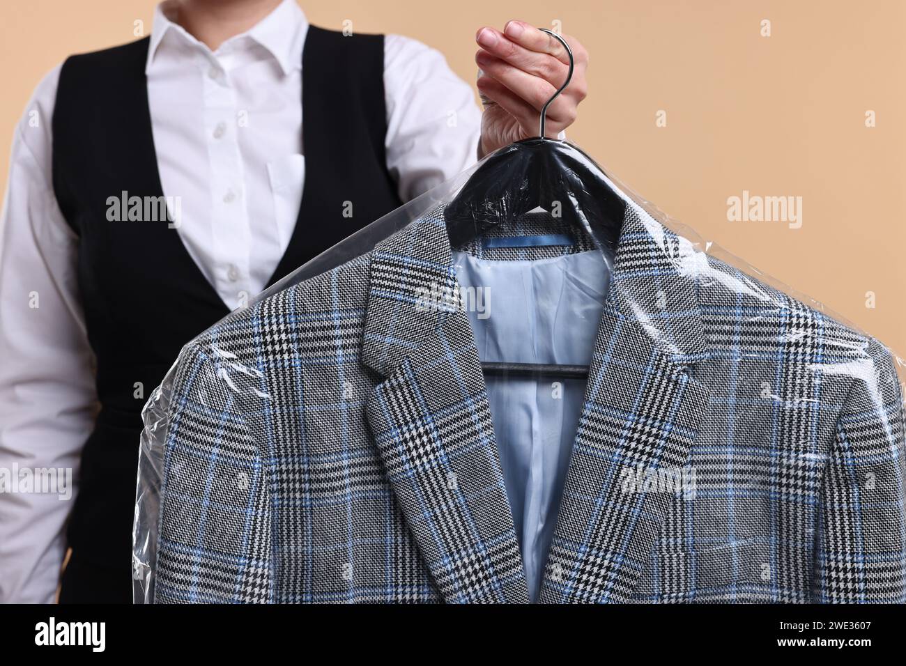 Woman business suit housework hi-res stock photography and images - Alamy