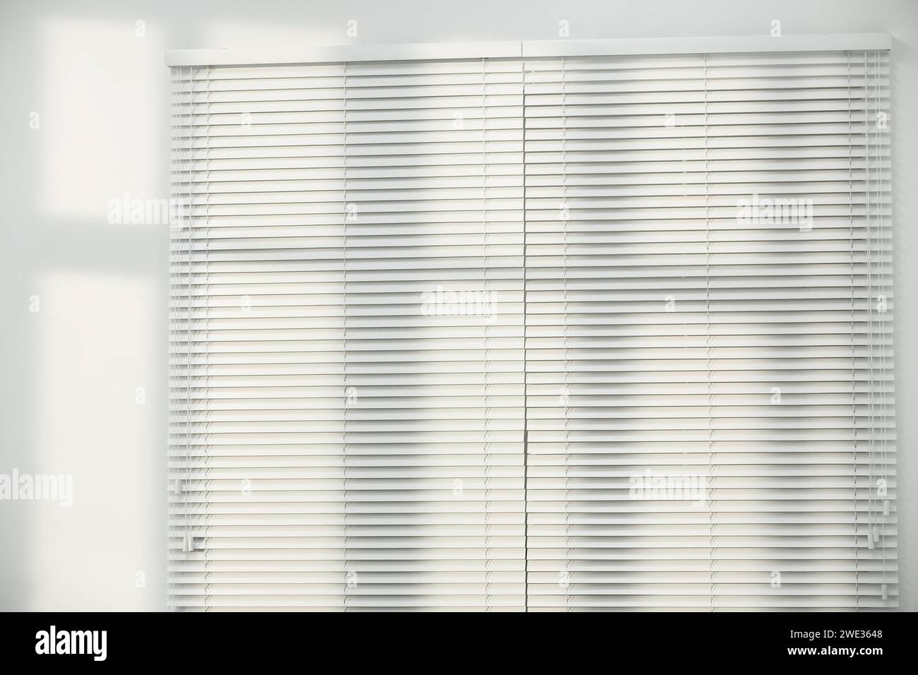 Light and shadows from window on wall indoors Stock Photo - Alamy