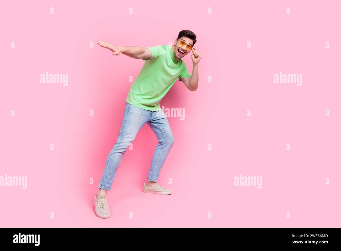 Full length photo of young funny guy dancing energetic good vibes touch ...