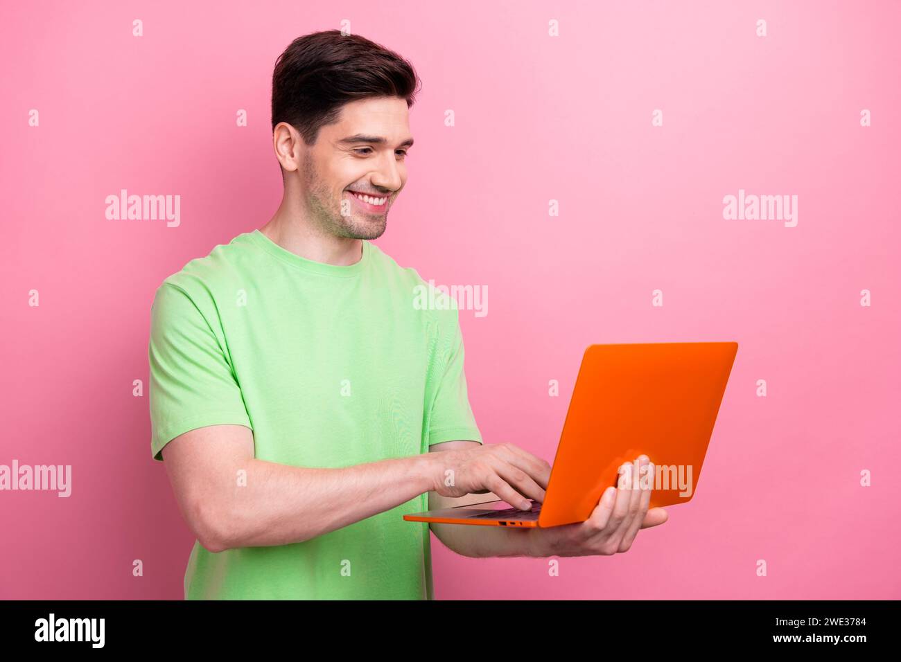 Photo of young man programmer web designer using netbook to create ...
