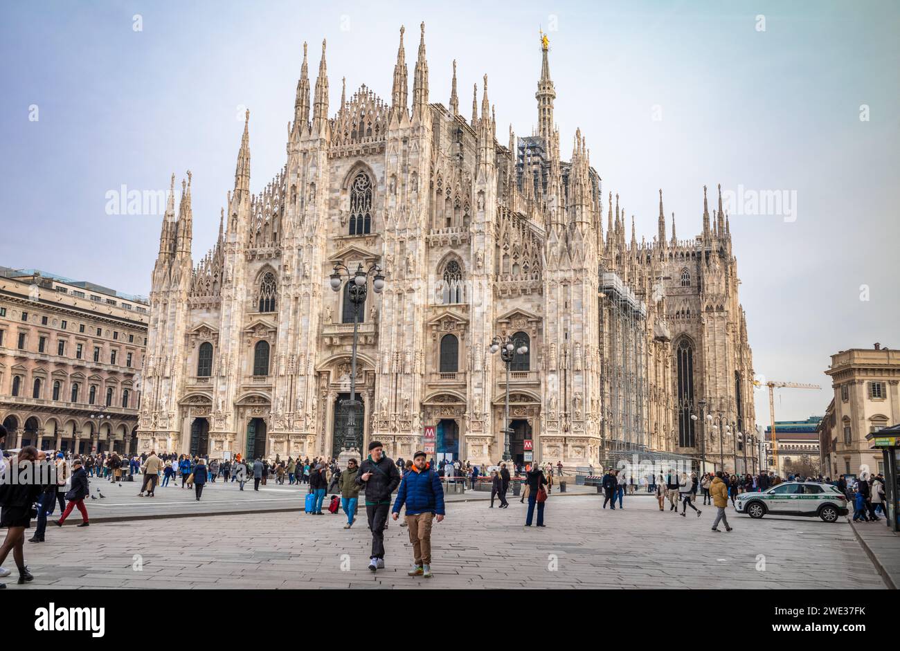 People walk in the Piazza del Duomo in front of the Duomo di Milano ...