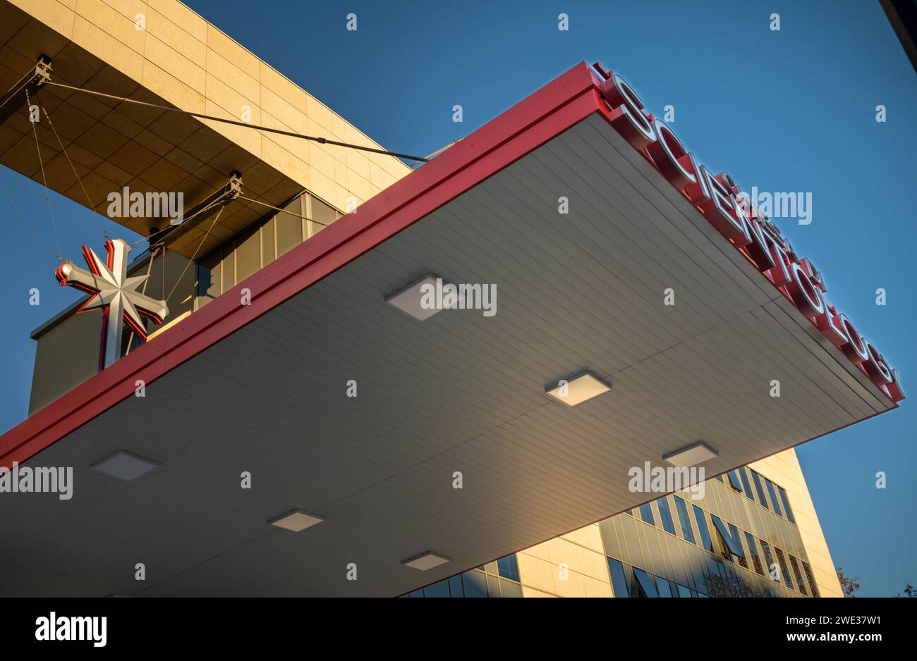 The cross and sign above the main entrance to the modern Church of ...