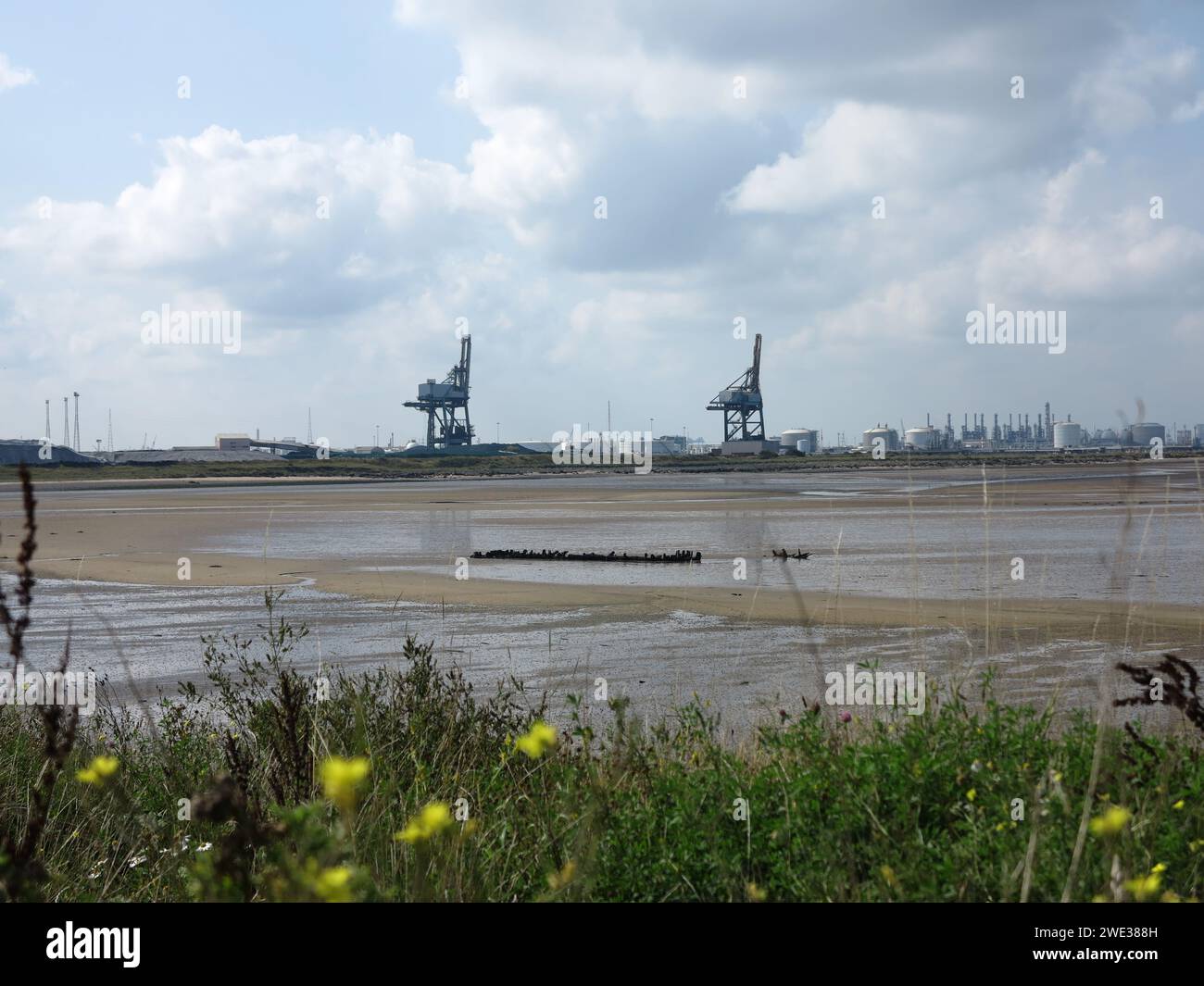 Old ship remains and cranes in Middlesbrough Harbour Stock Photo - Alamy