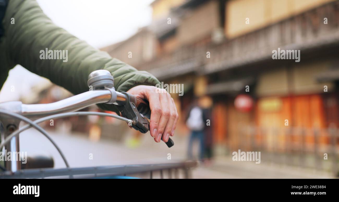 Hands, bicycle and brake handle in street, travel and transport outdoor ...