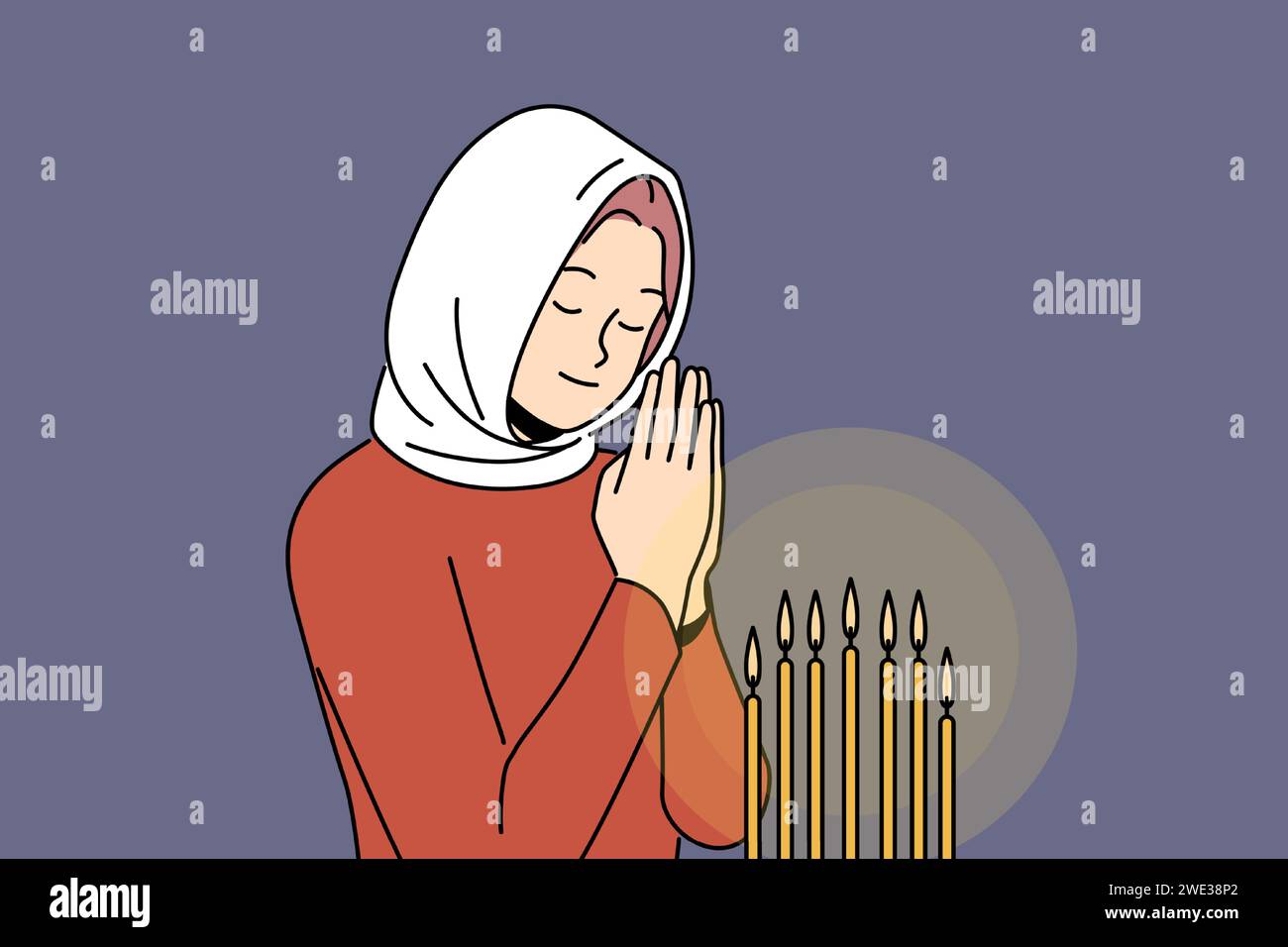 Praying woman stands in orthodox church near altar with candles and ...