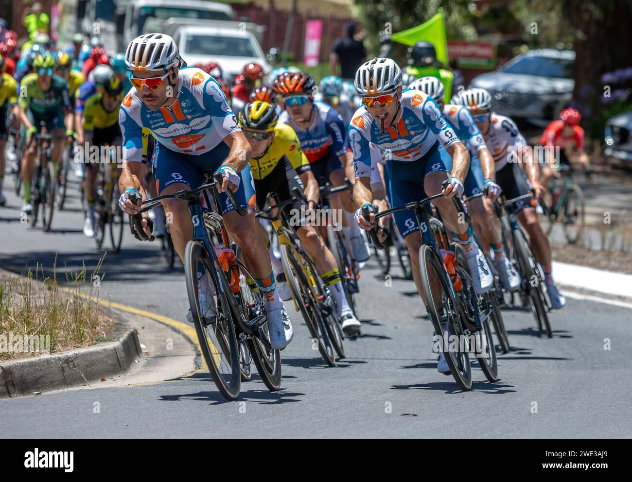 Riders from DSM-Firmenich Postnl corner onto Main Street at Crafers in ...