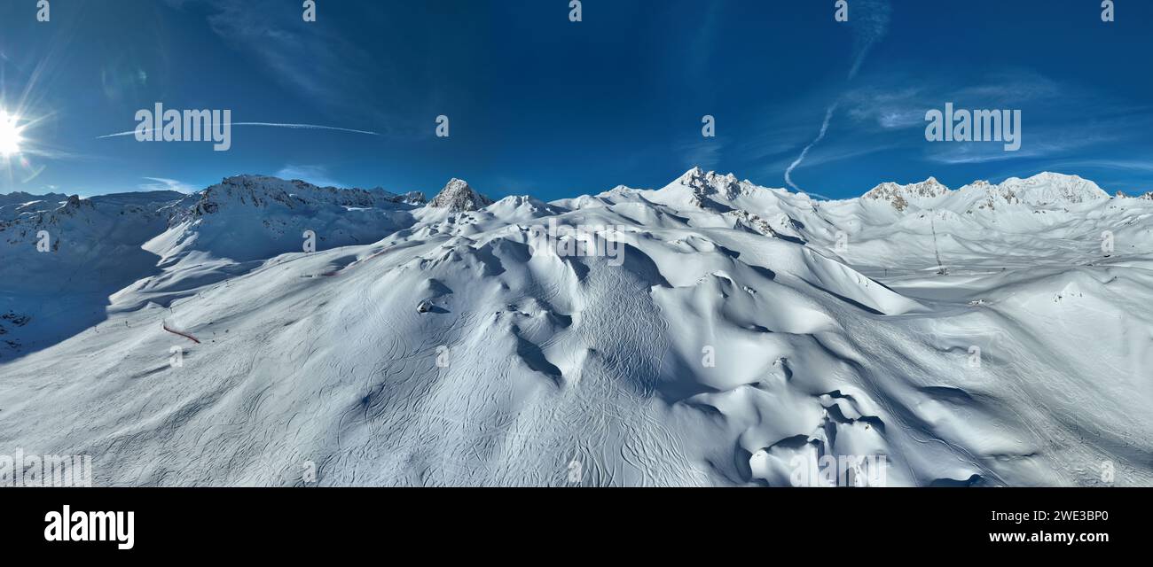 Winter drone shot of ski pistes and slopes covered with fresh powder ...