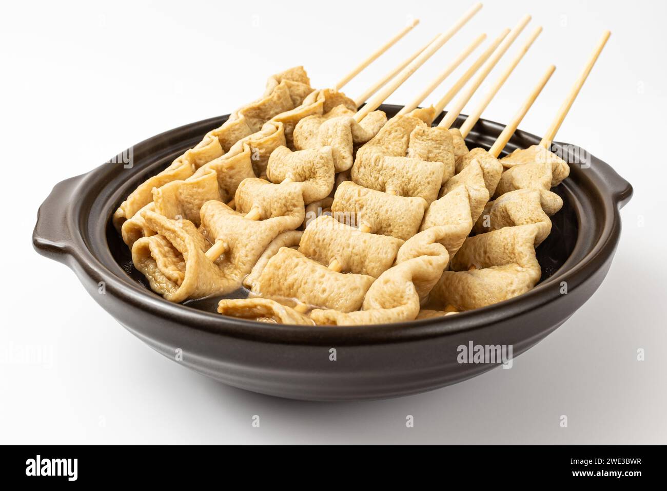 Skewered fish cake on white background Stock Photo - Alamy