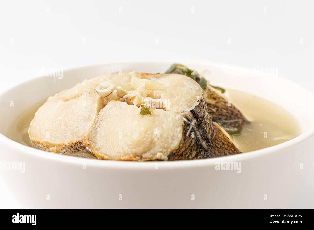Cod soup on a white background Stock Photo - Alamy