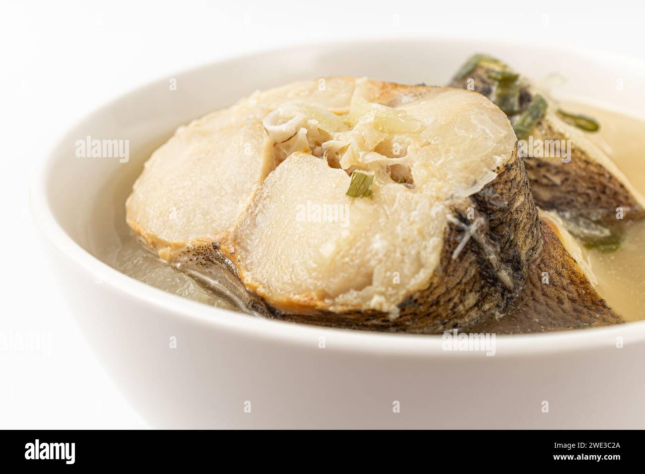 Cod soup on a white background Stock Photo - Alamy