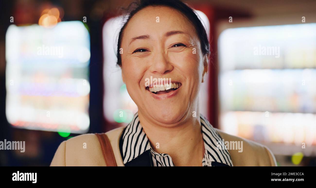 Japanese, woman and face with laughing in city for comedy, joke or ...
