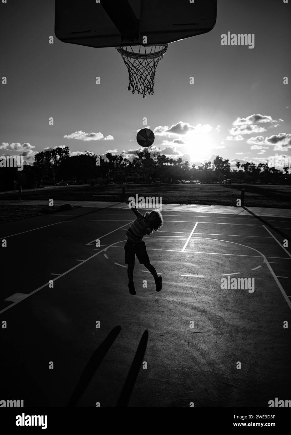 Cute little boy child jumping with basket ball for shot. Little child ...
