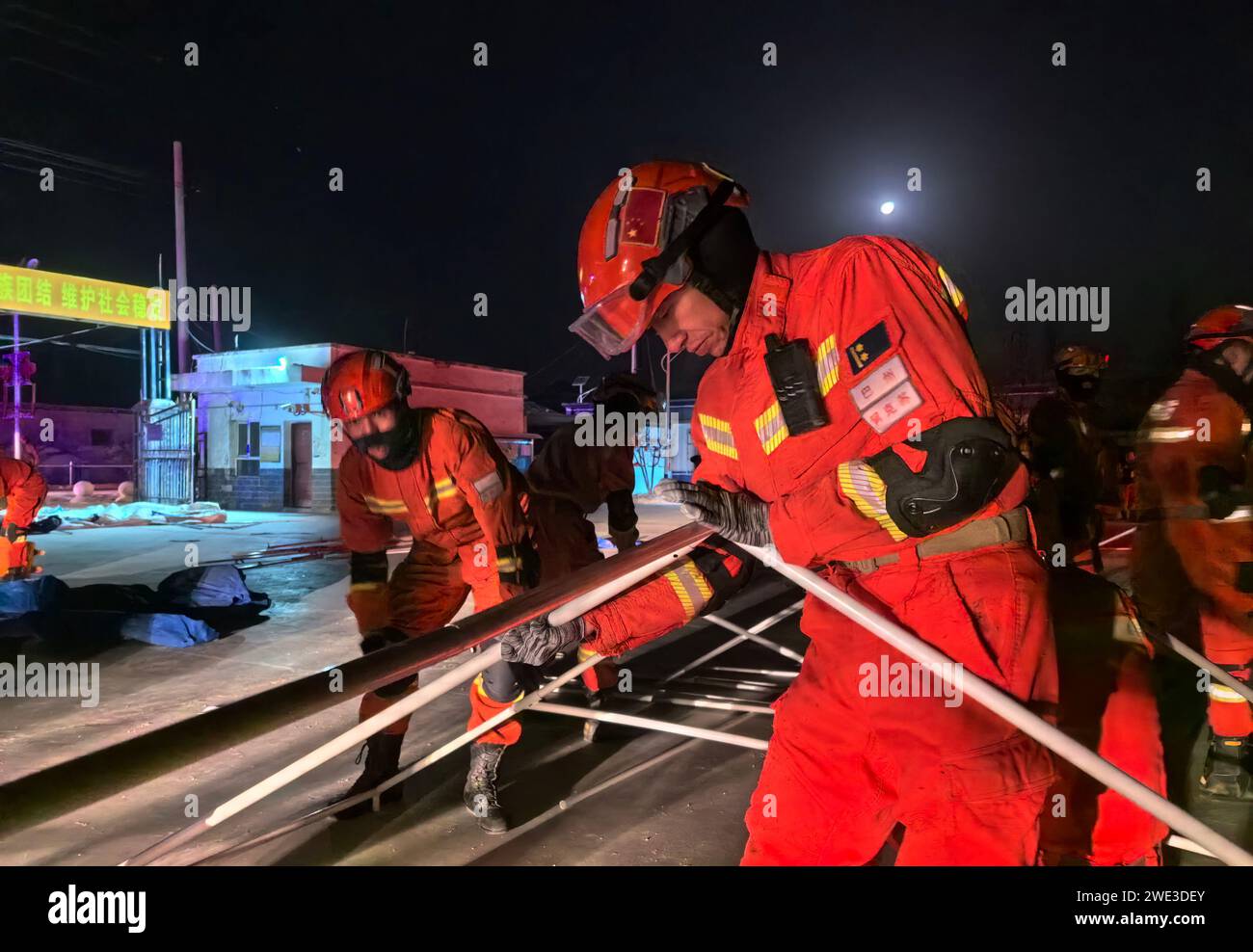 Aksu, China. 23rd Jan, 2024. Rescuers set up tents at a temporary ...