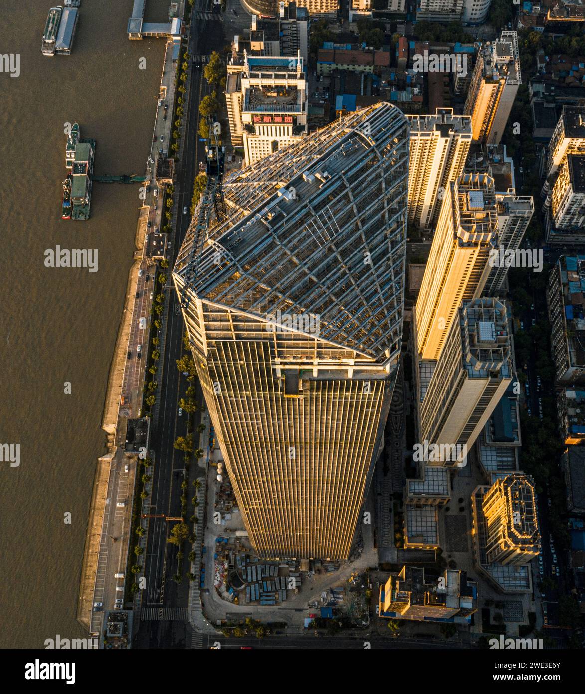 Aerial view of A skyscraper decorated with glass curtain walls by the ...