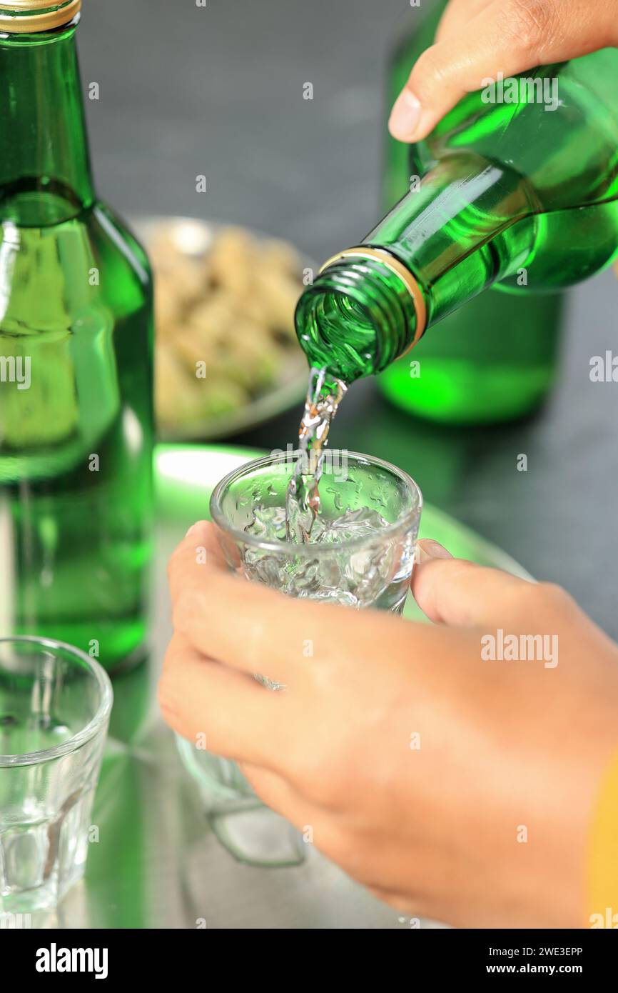 Close Up Pouring Soju to the Sloki. Soju is Korean Alcohol Lifestyle ...