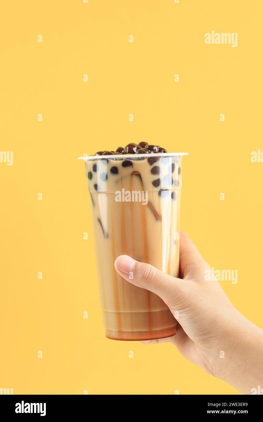 Female Hand Hold Taiwan Boba Pearl Milk Tea with Liquid palm Sugar ...