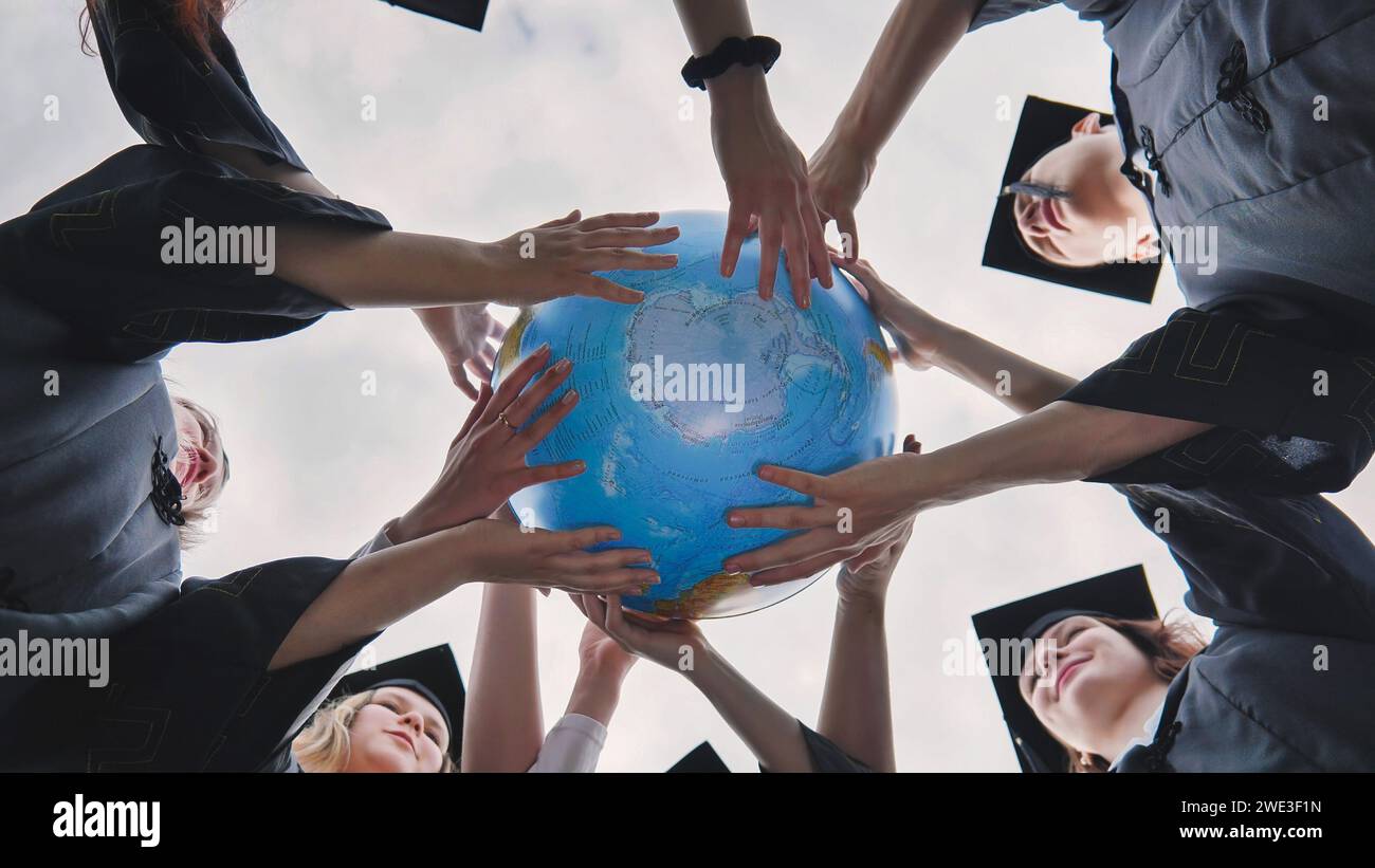 The concept of a world without war. College graduates holding a ...