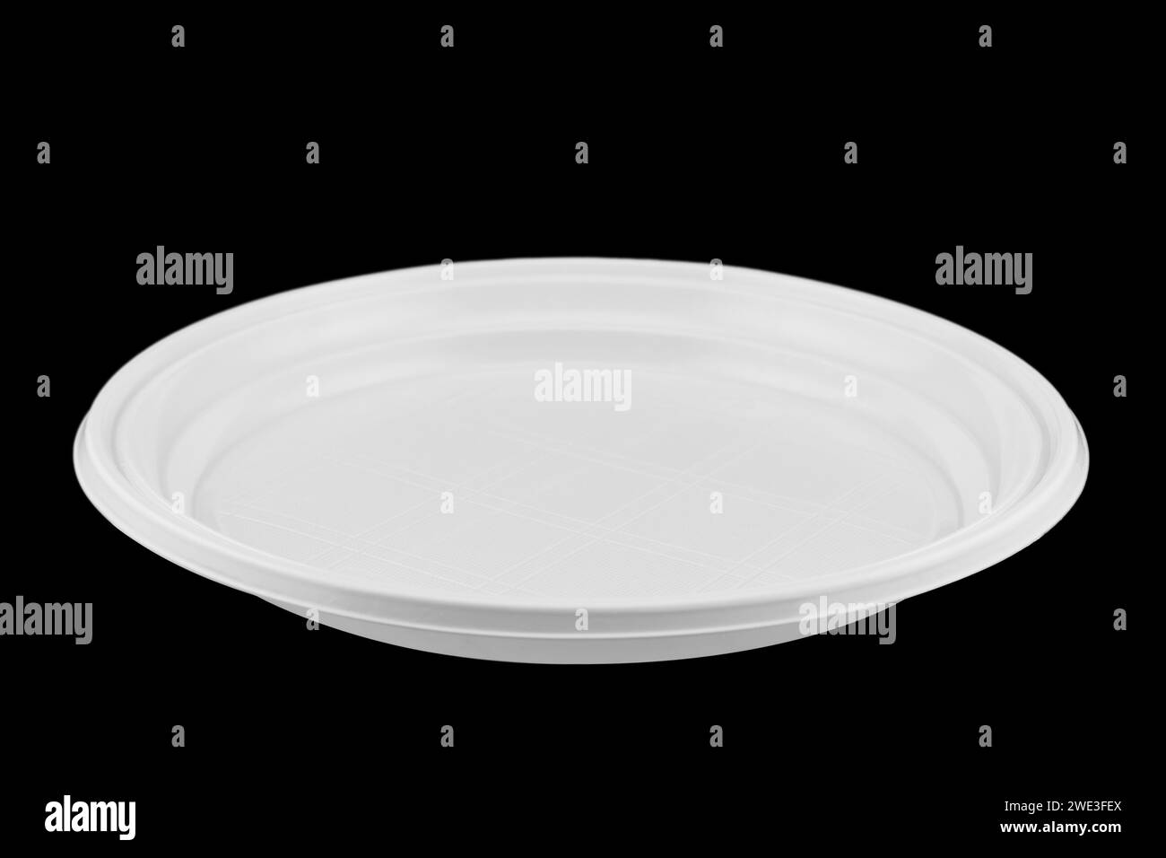Disposable white plastic plate isolated on black background Stock Photo ...