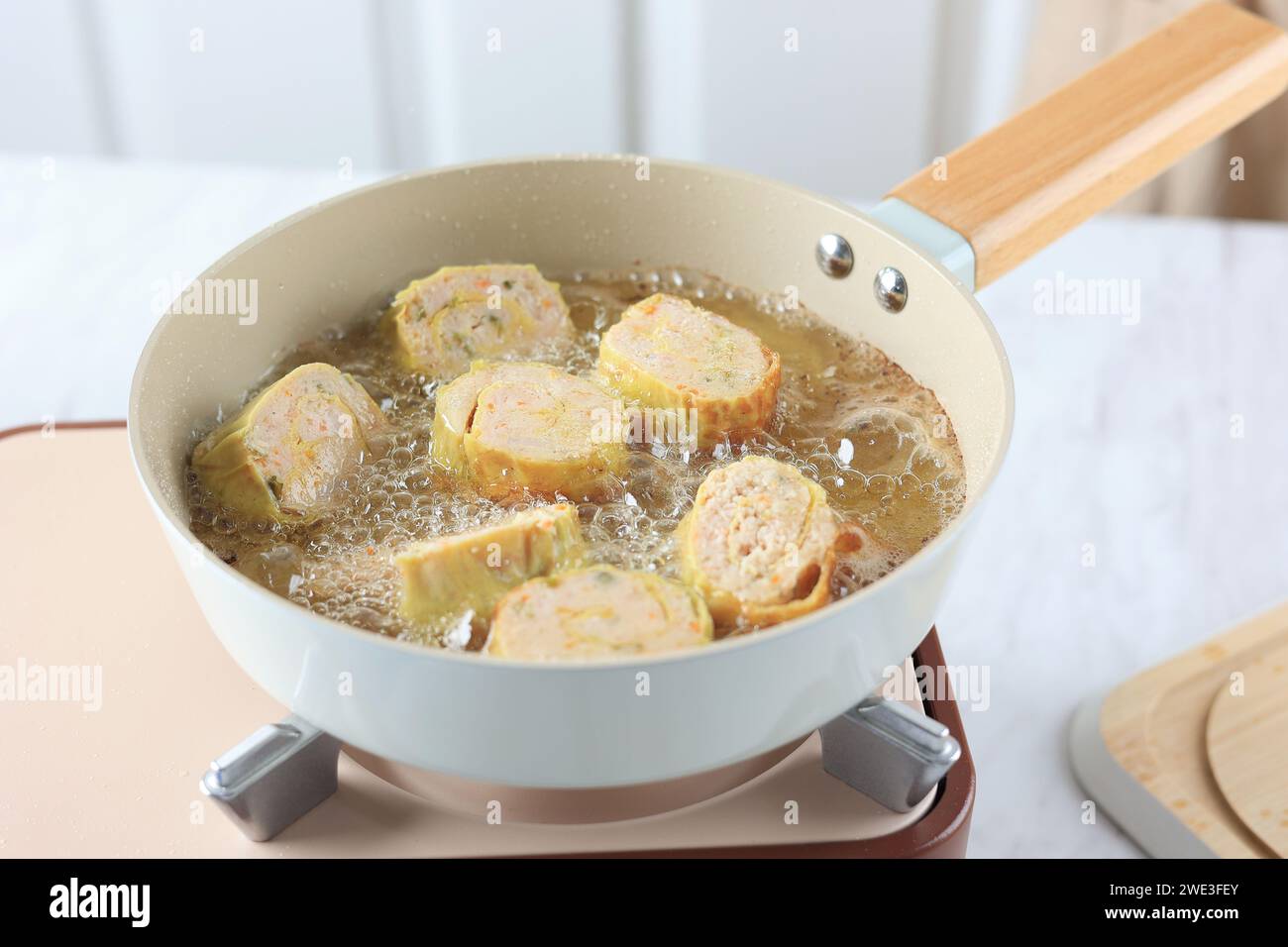 Frying Chicken Egg Roll in Hot Oil using White Pan, Cooking Backstage ...