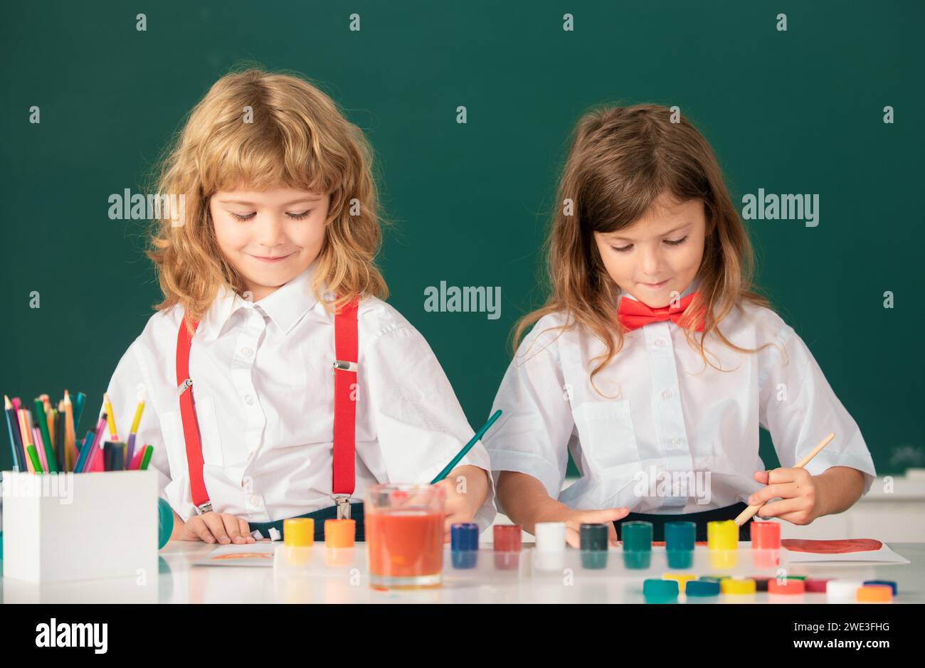 Kids pupils learning painting. Cute school friends kids drawing and ...