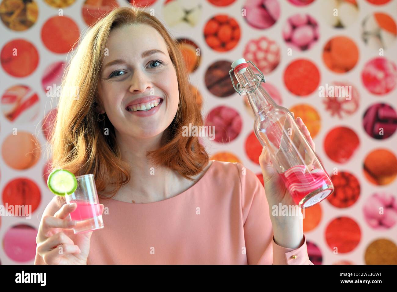 Cologne, Germany. 23rd Jan, 2024. Model Christin holds a glass of vodka ...