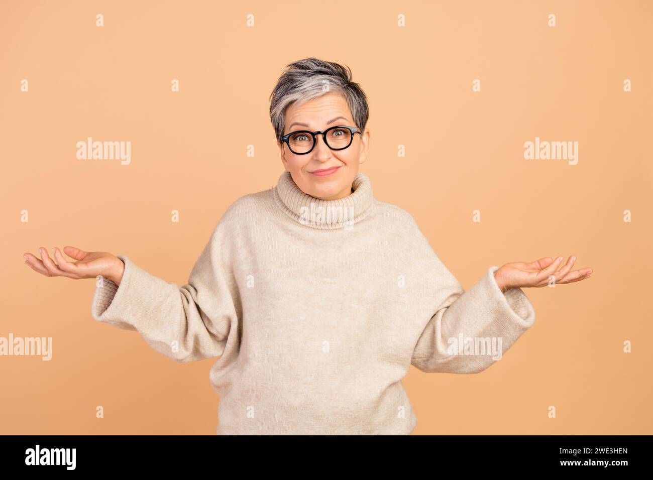 Portrait of clueless aged person shrug shoulders raise arms do not know ...