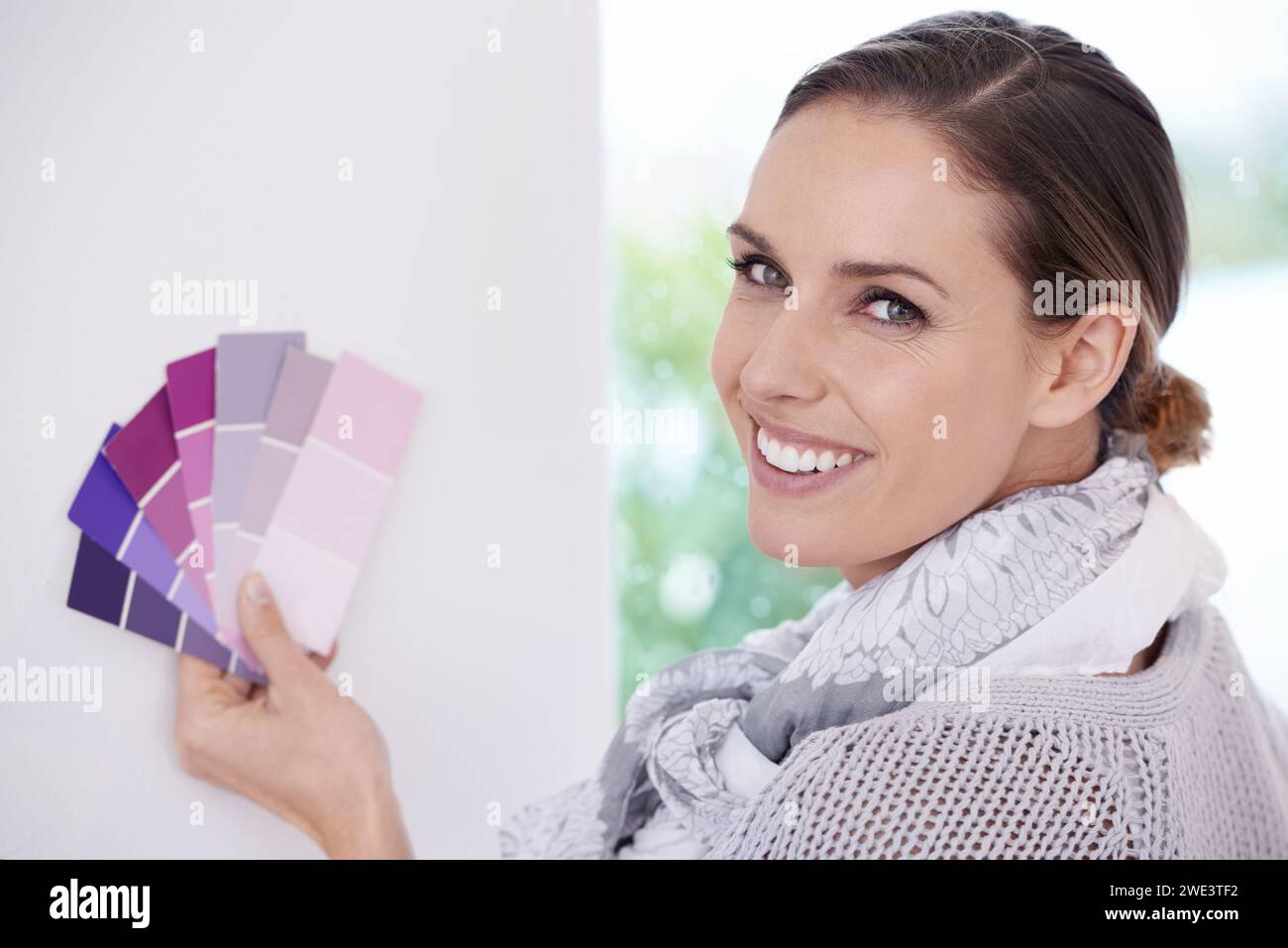 Home renovation, painting and portrait of woman with sample for color ...