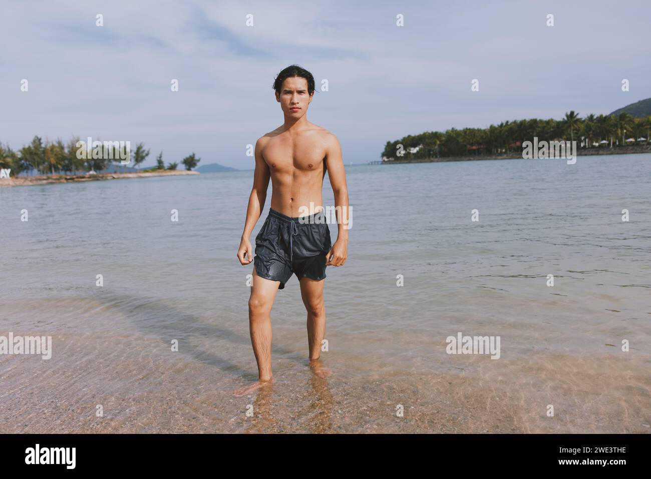 Smiling Asian Man Enjoying Active Summer Swim in Tropical Freedom Stock ...