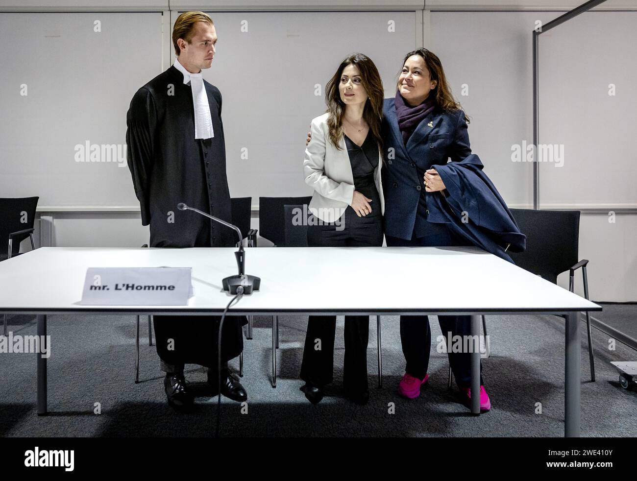 AMSTERDAM - Tahmina Akefi (M) with her lawyer Jordi L'Homme and friend ...